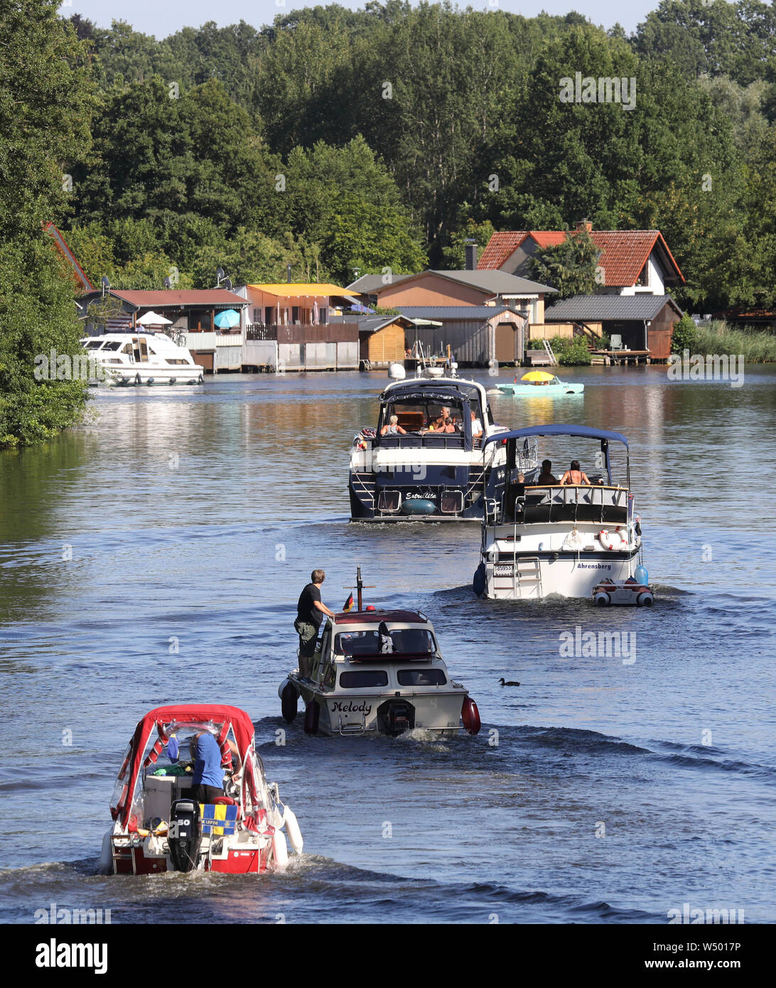 Mirow, Germany. 23rd July, 2019. Motor boats and houseboats leave the ...