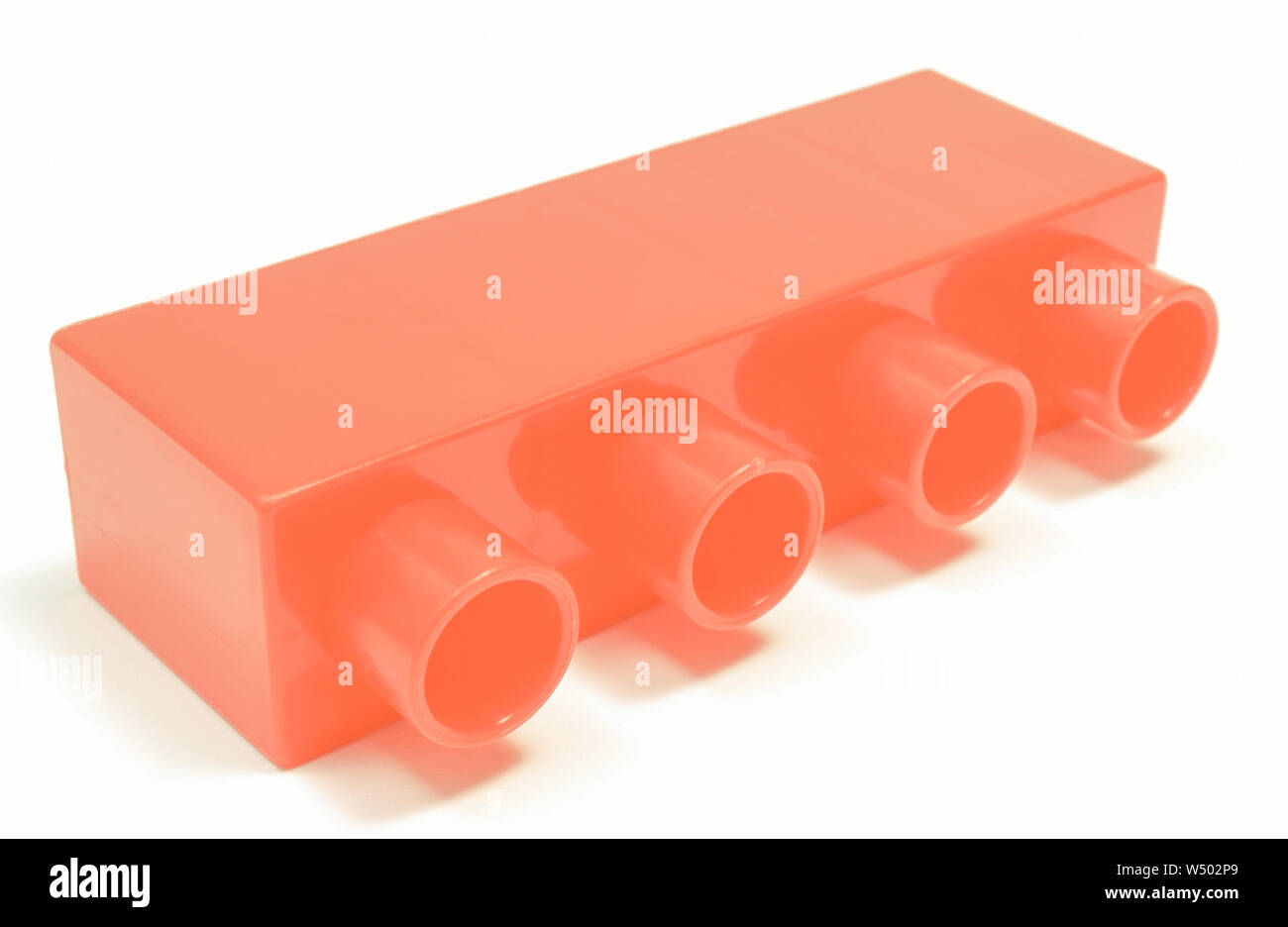 Closeup of red toy blocks for children on white background Stock Photo ...