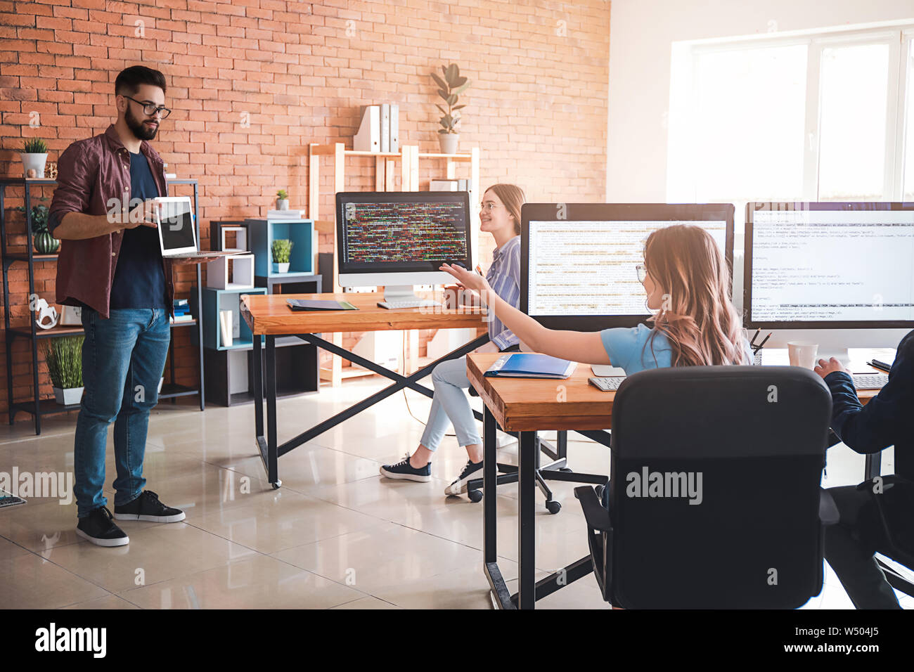 Female programmers working table hi-res stock photography and images ...