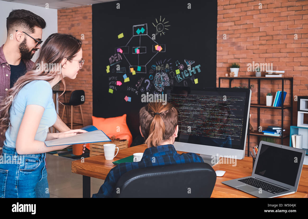 Female programmers working table hi-res stock photography and images - Alamy
