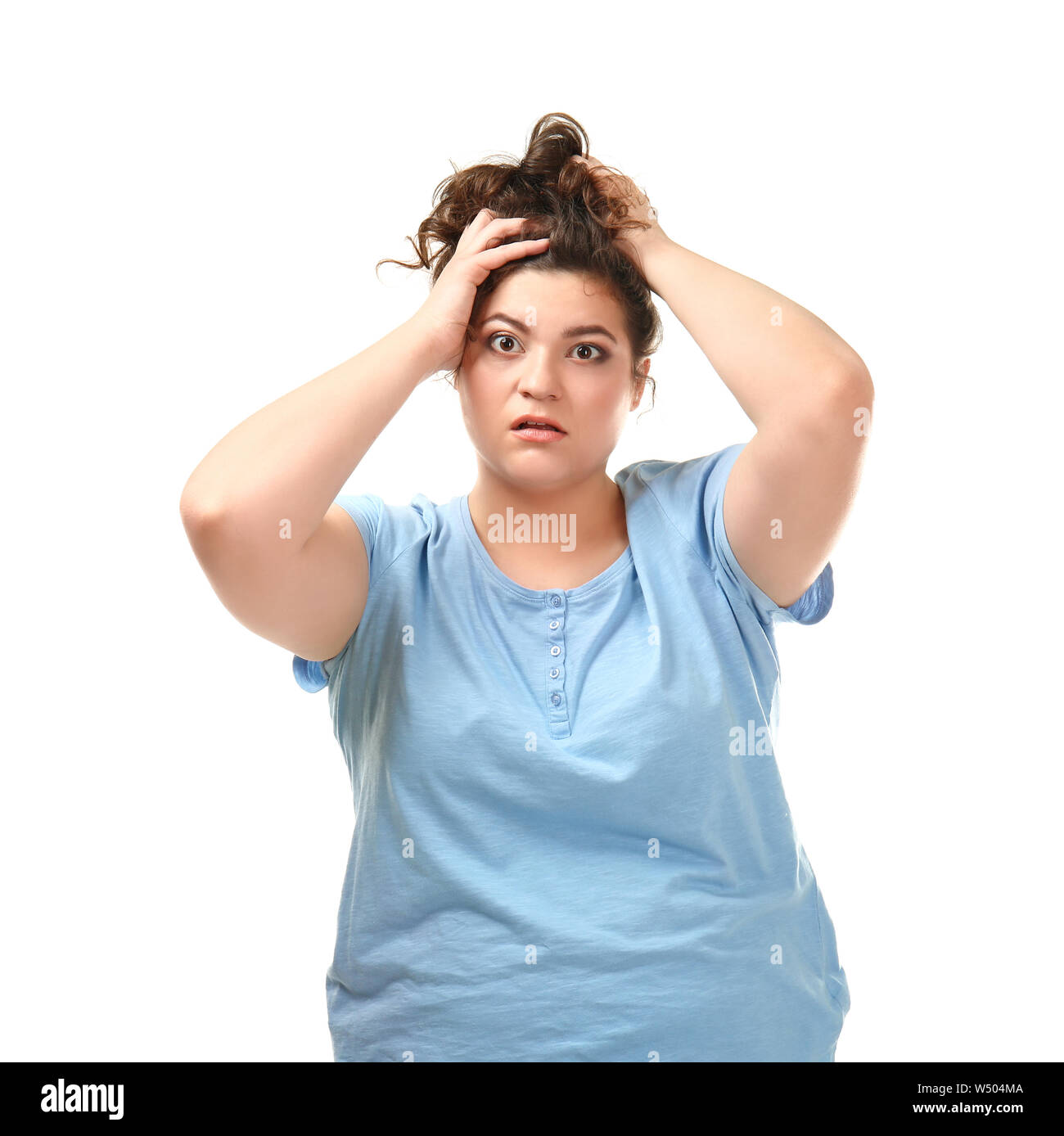 Stressed overweight woman on white background Stock Photo - Alamy