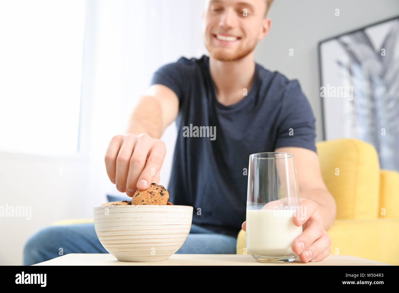 Adult man eating cookies hi-res stock photography and images - Alamy