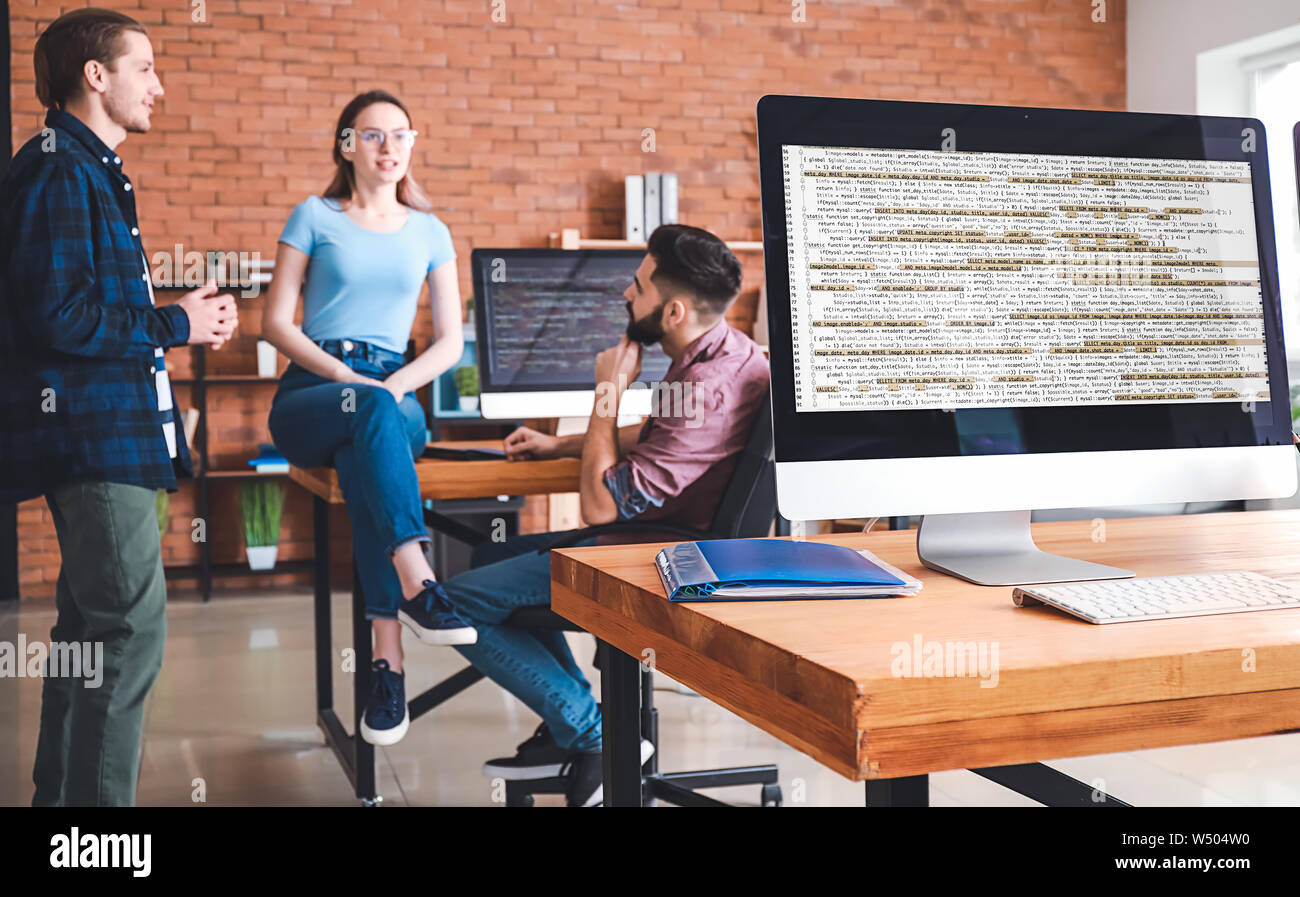 Team of programmers during break in office Stock Photo - Alamy