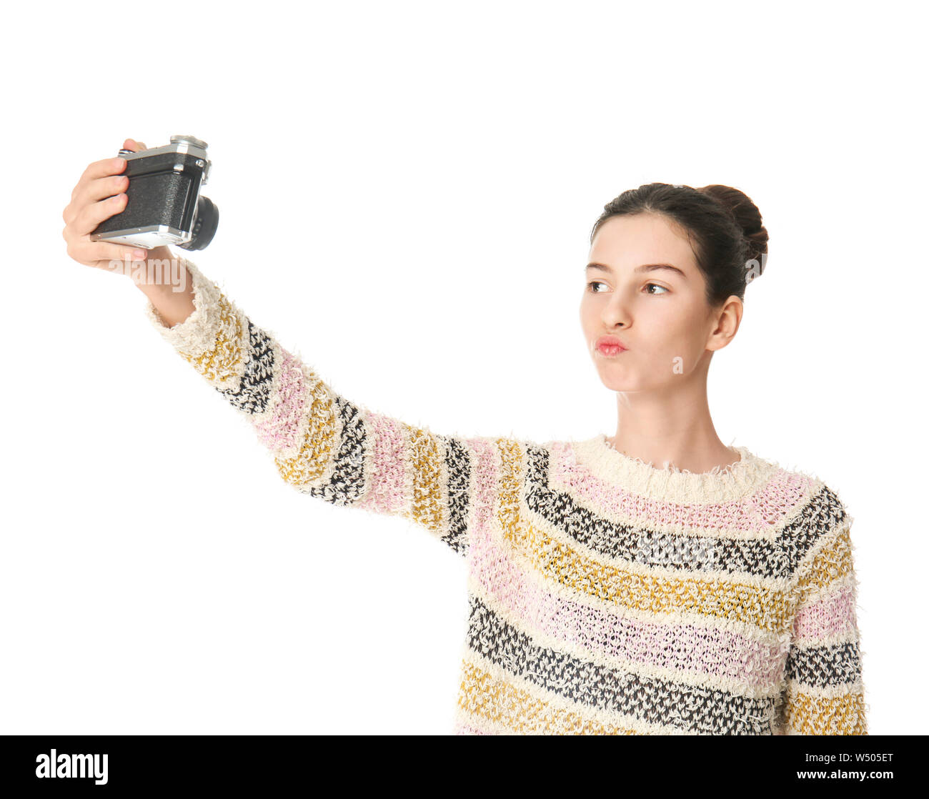 Young girl with photo camera taking selfie on white background Stock ...