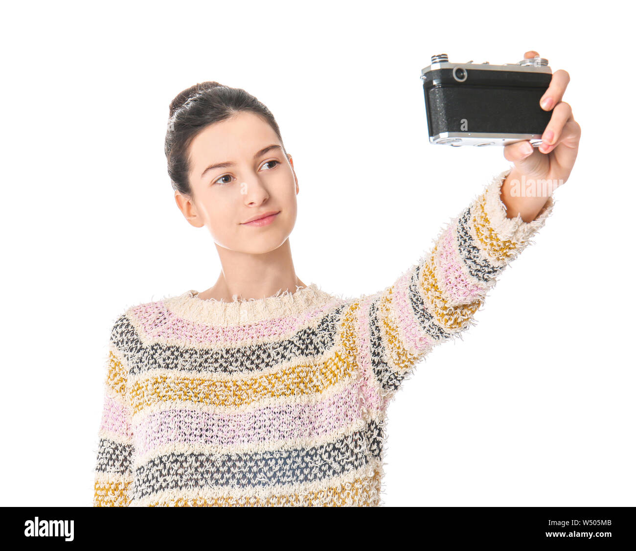 Young girl with photo camera taking selfie on white background Stock ...