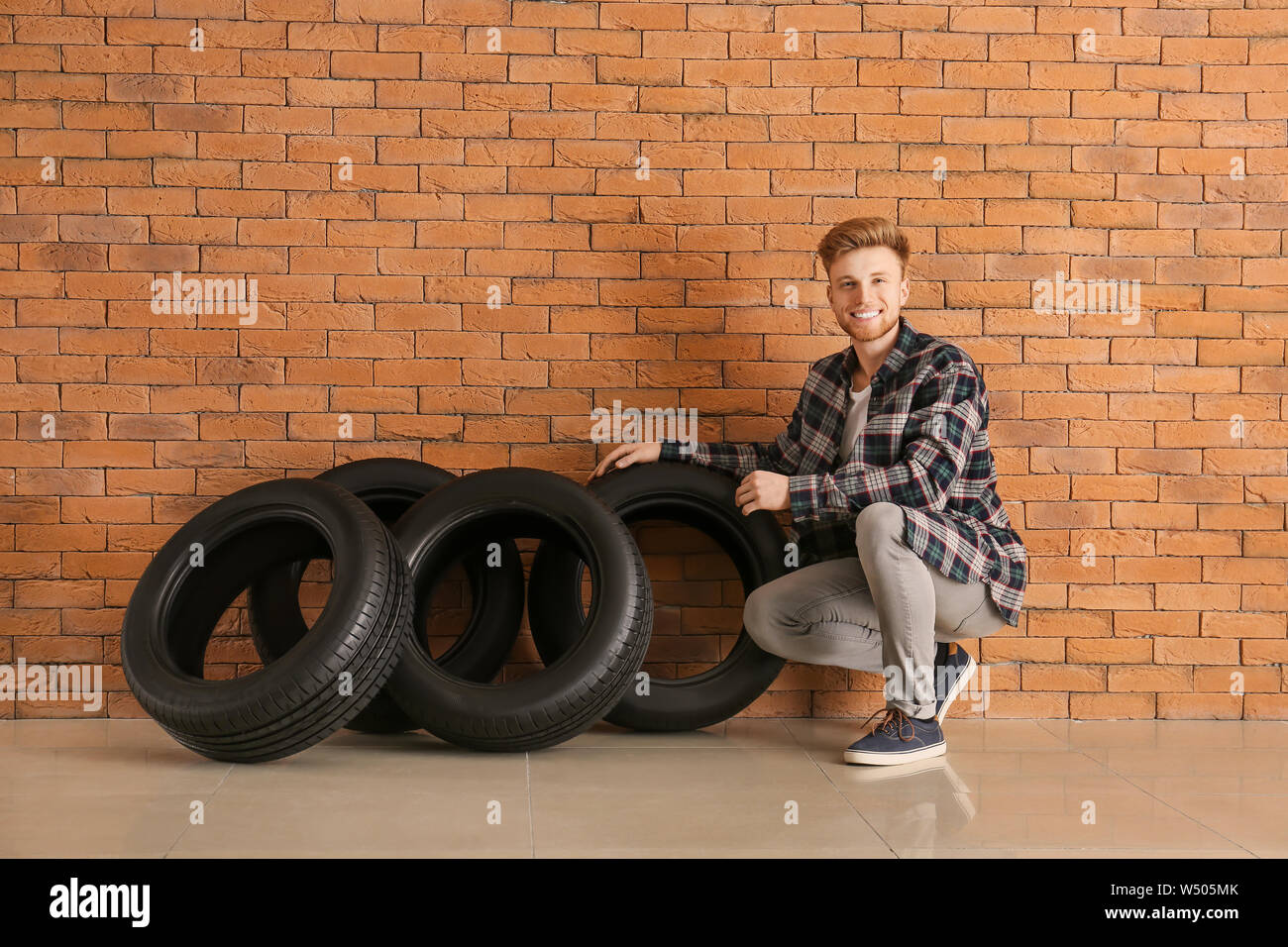 Man with tires hi-res stock photography and images - Alamy