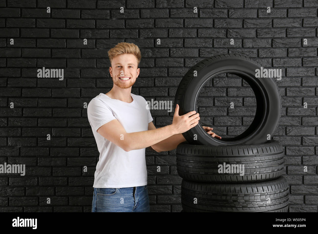 Man with tires hi-res stock photography and images - Alamy