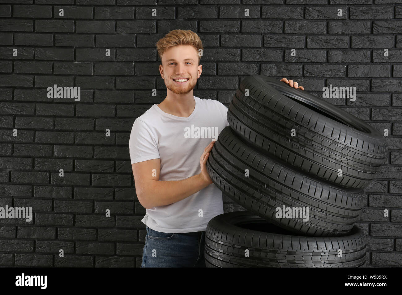 Man with tires hi-res stock photography and images - Alamy