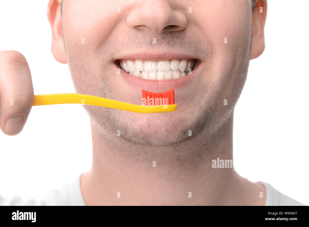 Man with toothbrush on white background, closeup. Concept of dental ...