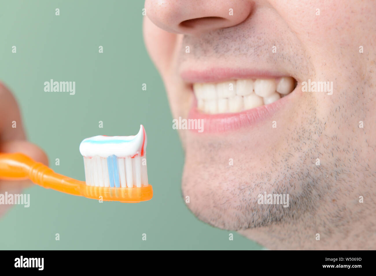 Man with toothbrush on color background, closeup. Concept of dental ...