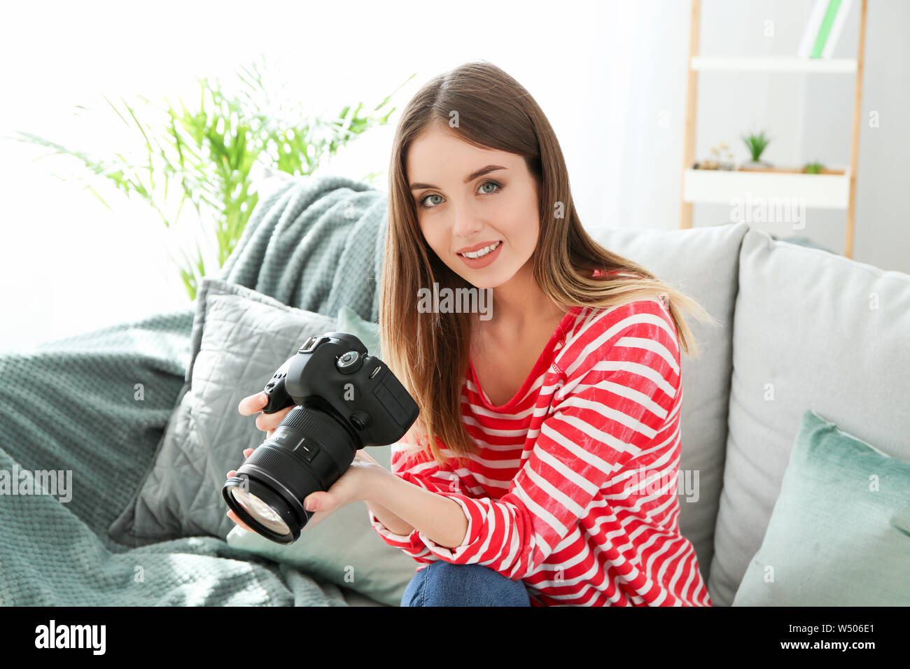 Young female photographer at home Stock Photo - Alamy