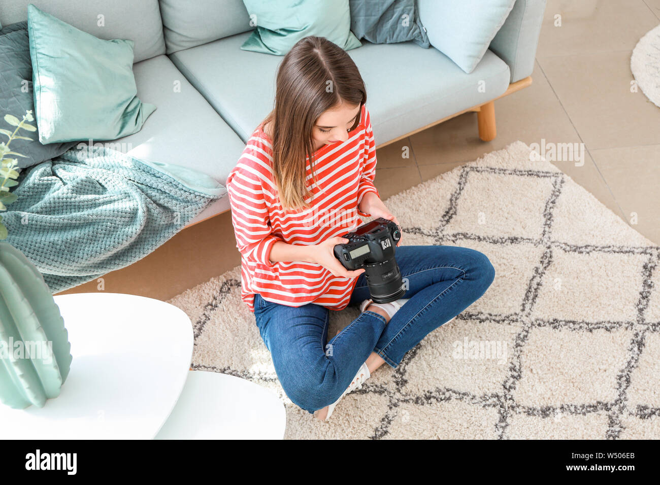 Young female photographer at home Stock Photo - Alamy