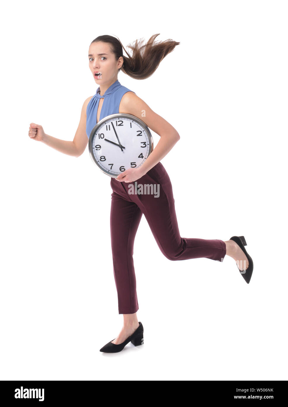 Running young businesswoman with clock on white background Stock Photo ...