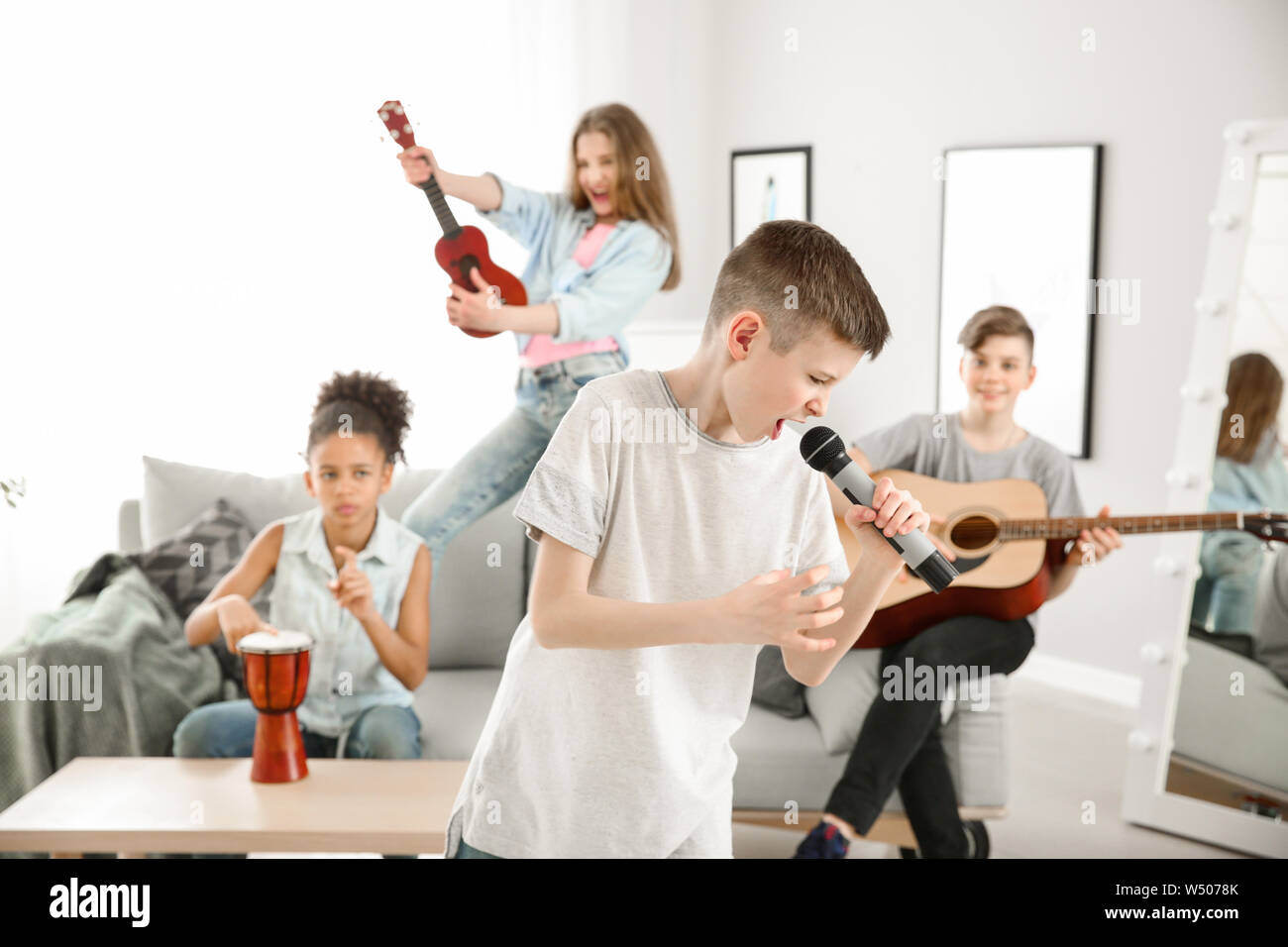 Teenage musicians playing and singing at home Stock Photo - Alamy
