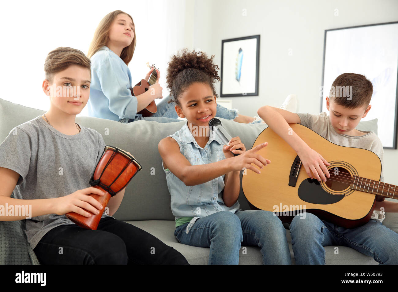 Teenage playing instrument band home hi-res stock photography and ...