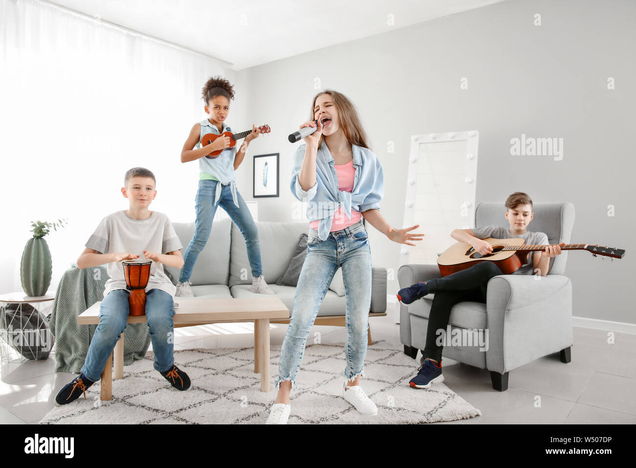 Teenage musicians playing and singing at home Stock Photo - Alamy