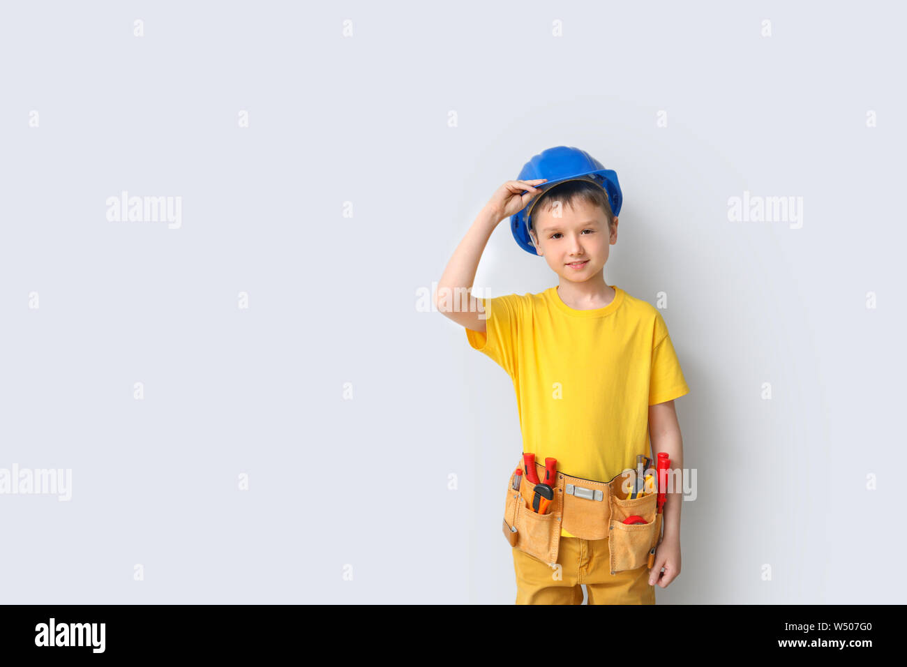 Cute little worker on white background Stock Photo - Alamy