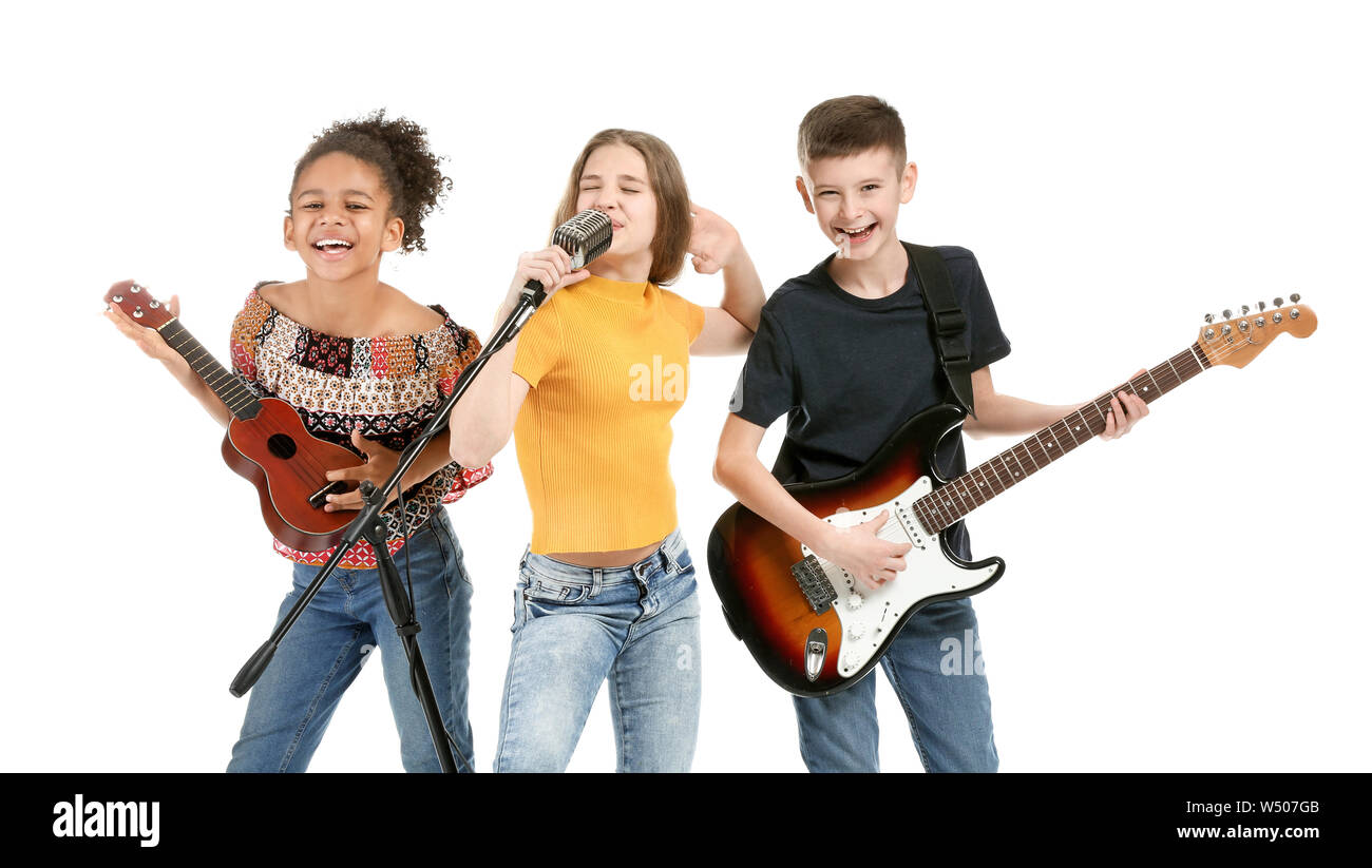 Teenage musicians playing against white background Stock Photo - Alamy