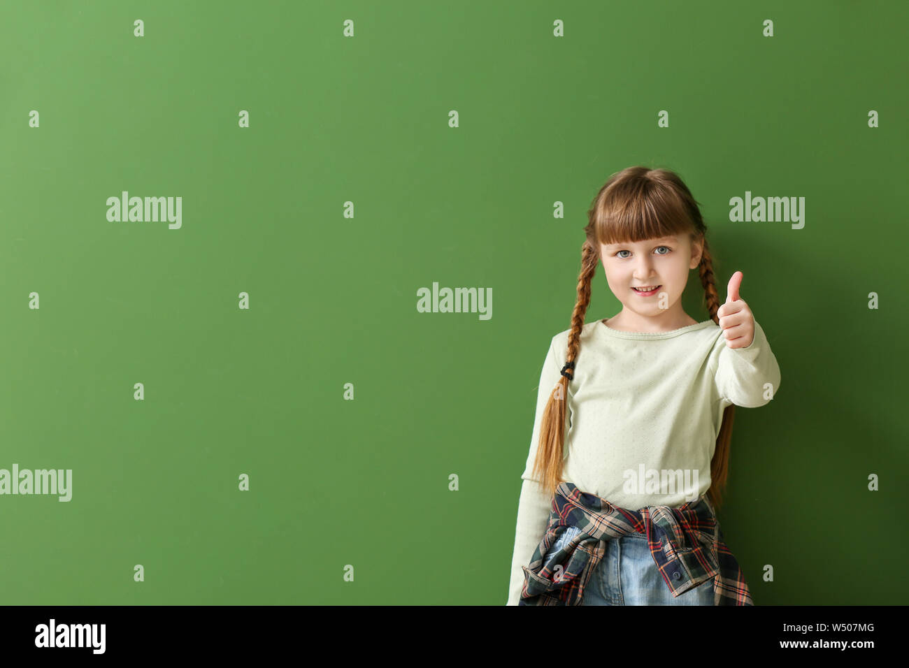 Cute deaf mute girl using sign language on color background Stock Photo ...