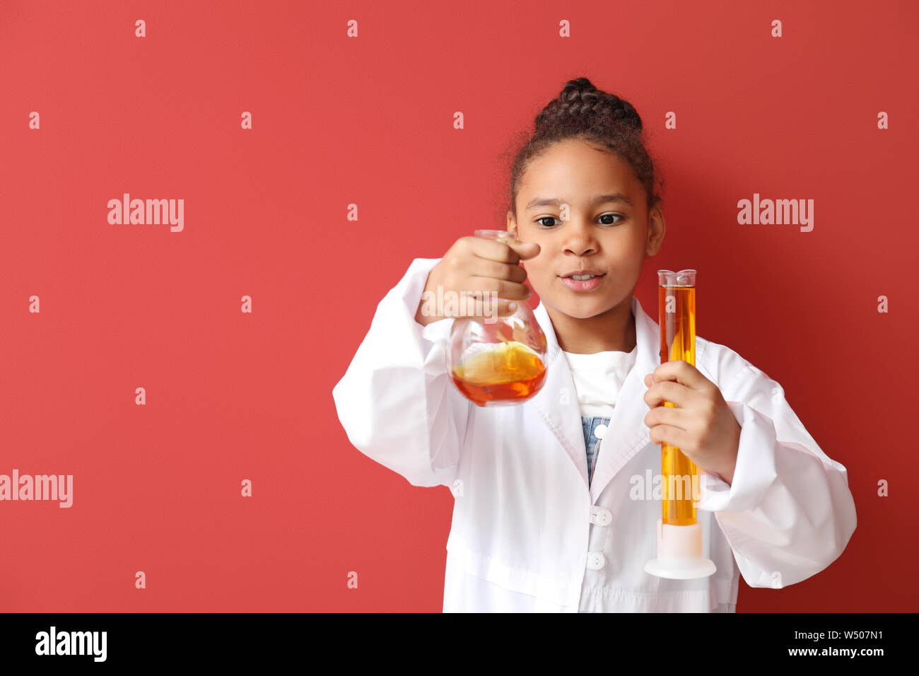 Little African-American scientist on color background Stock Photo - Alamy