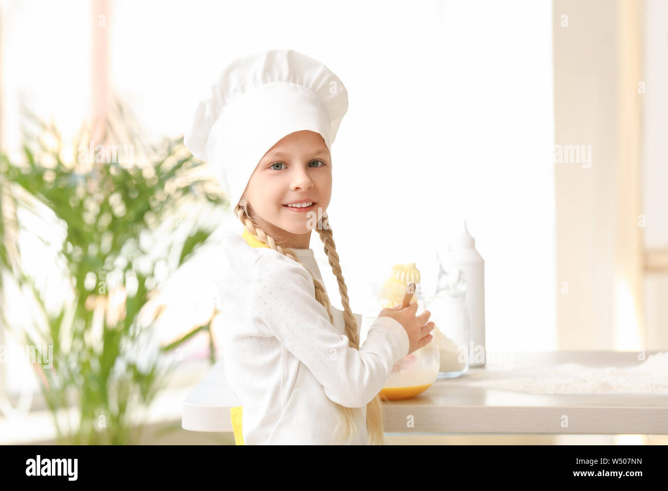 Cute little chef cooking in kitchen Stock Photo - Alamy