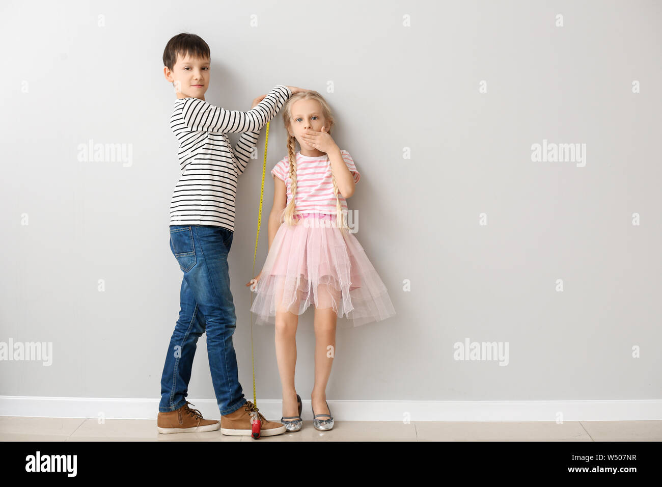 Children measuring with ruler hi-res stock photography and images - Alamy
