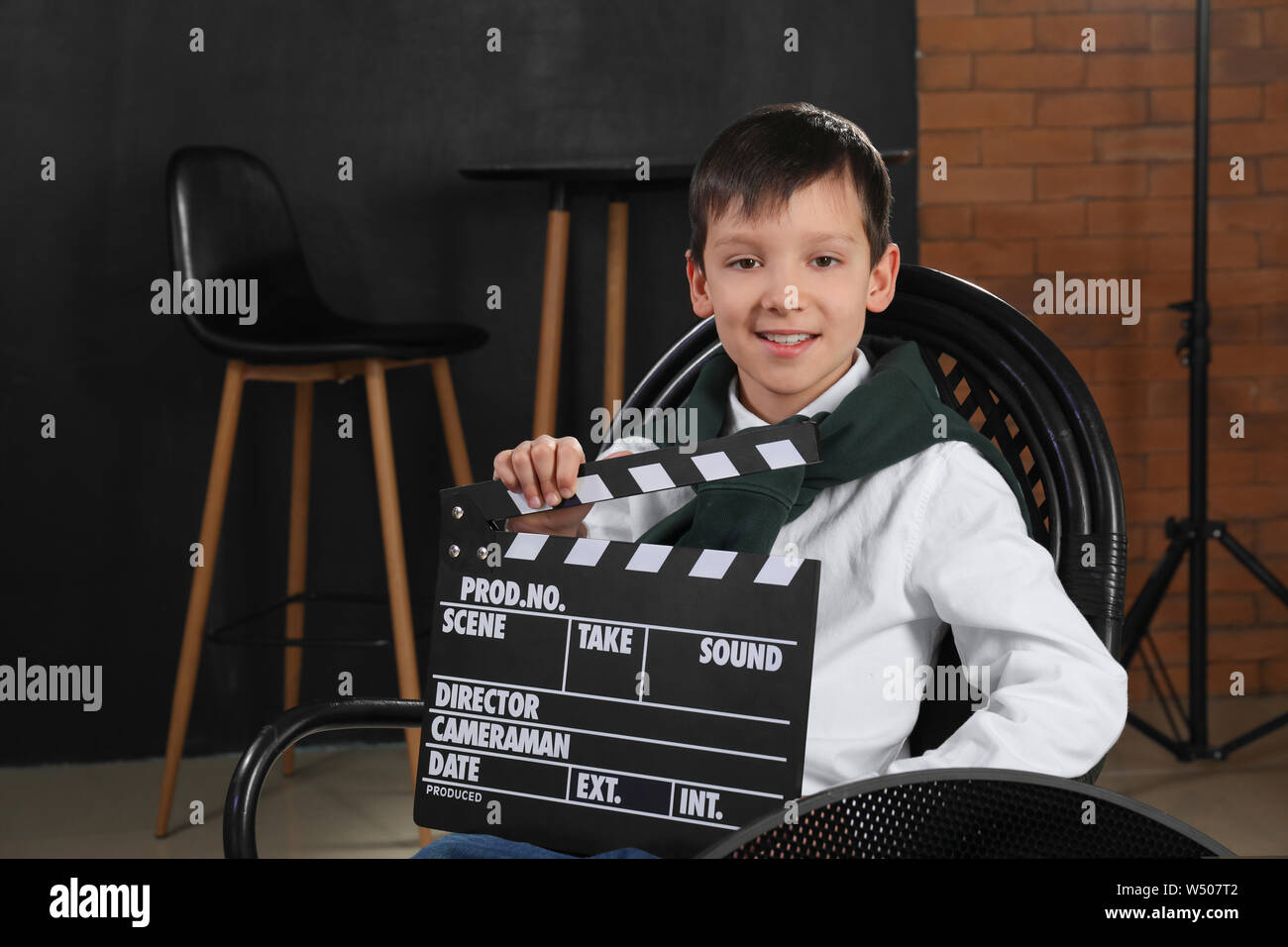 Little film director with clapperboard in studio Stock Photo - Alamy