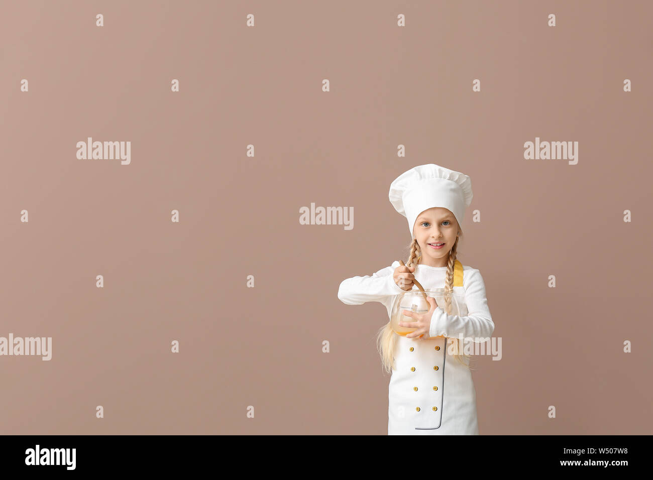 Cute little chef on color background Stock Photo - Alamy