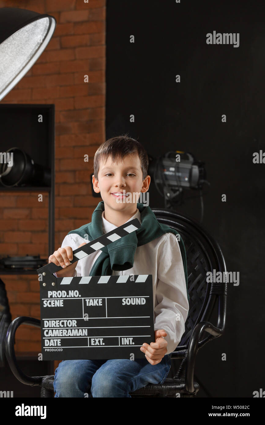 Little film director with clapperboard in studio Stock Photo - Alamy