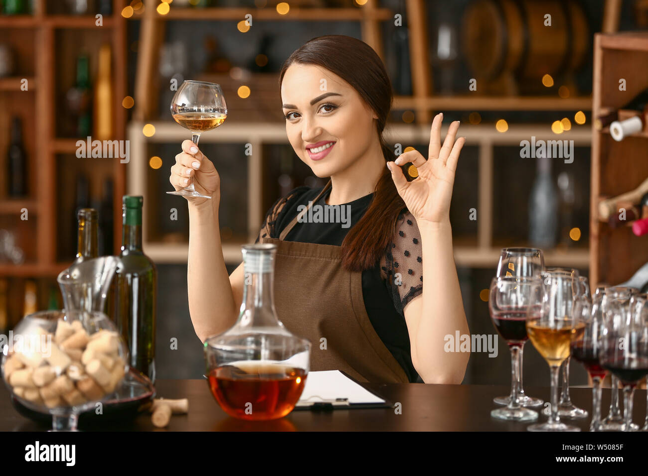 Female sommelier working in wine cellar Stock Photo - Alamy