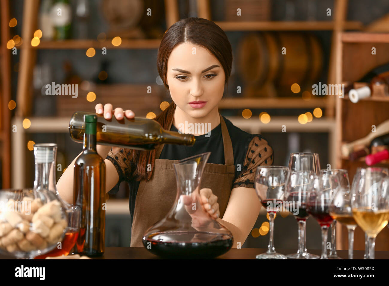 Female sommelier working in wine cellar Stock Photo - Alamy