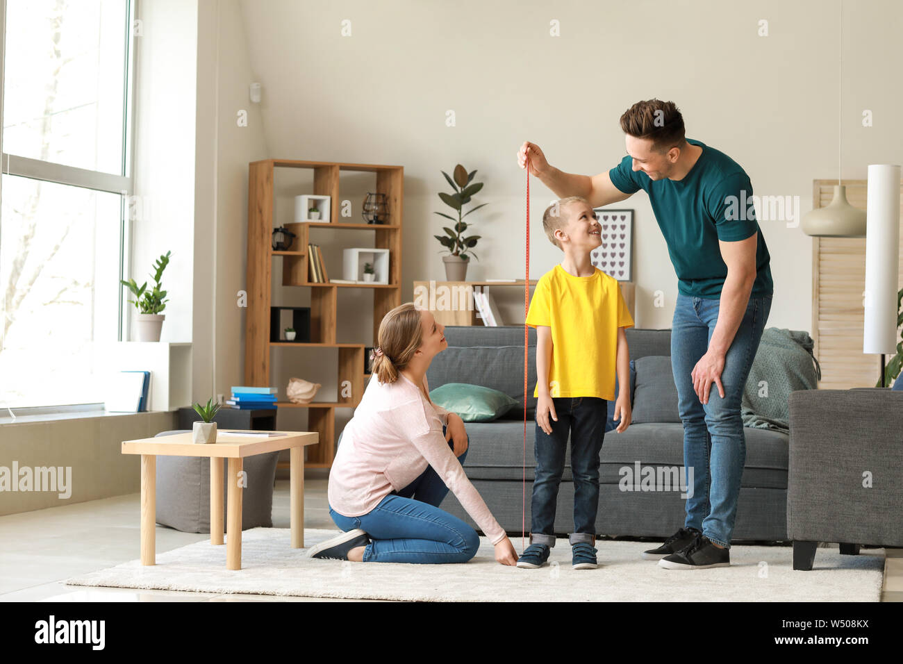 Tall boy parents hi-res stock photography and images - Alamy