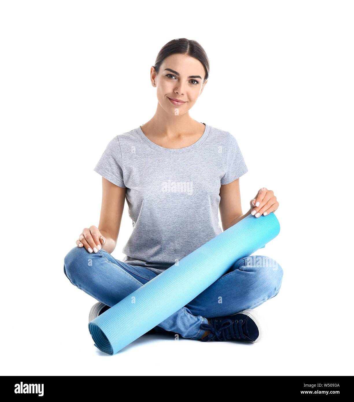 Beautiful woman with yoga mat on white background Stock Photo - Alamy