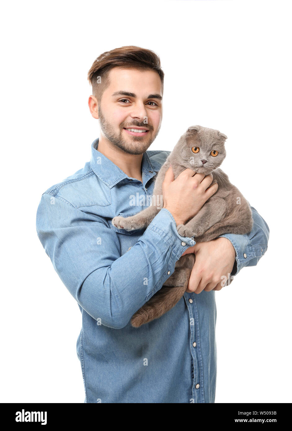 Young man with cute funny cat on white background Stock Photo - Alamy