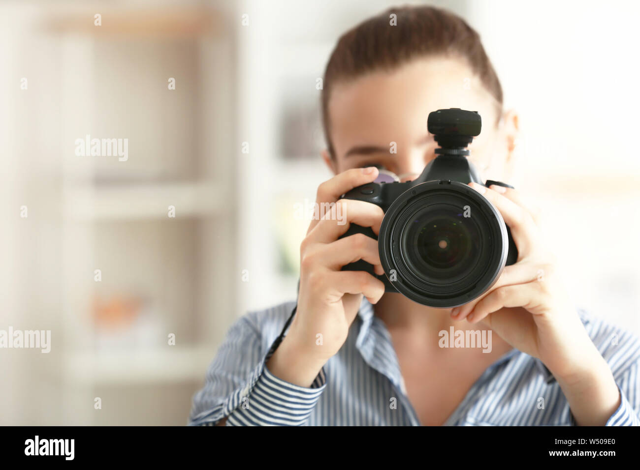 Teenage girl with photo camera at home Stock Photo - Alamy