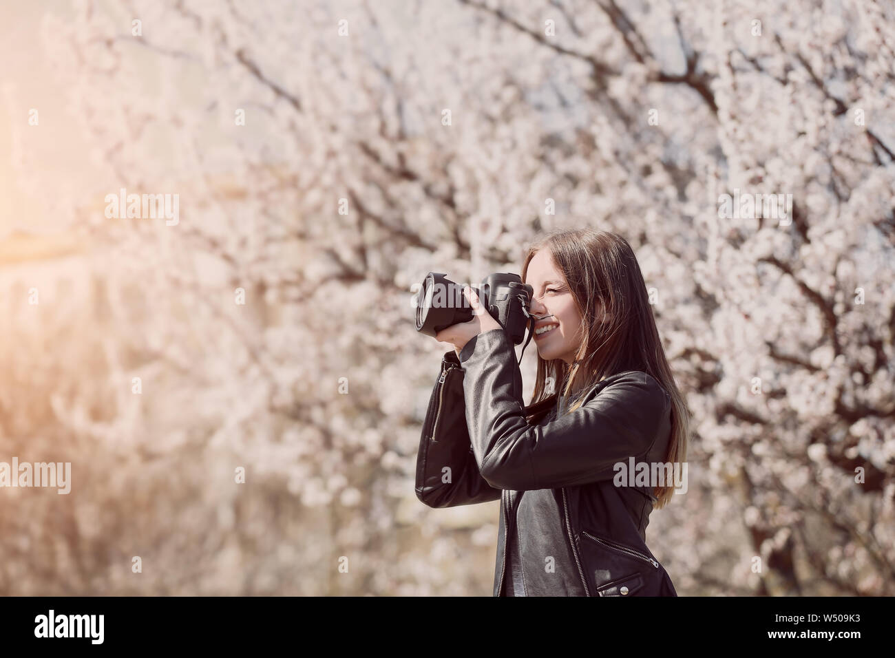 Beautiful female photographer working outdoors Stock Photo - Alamy