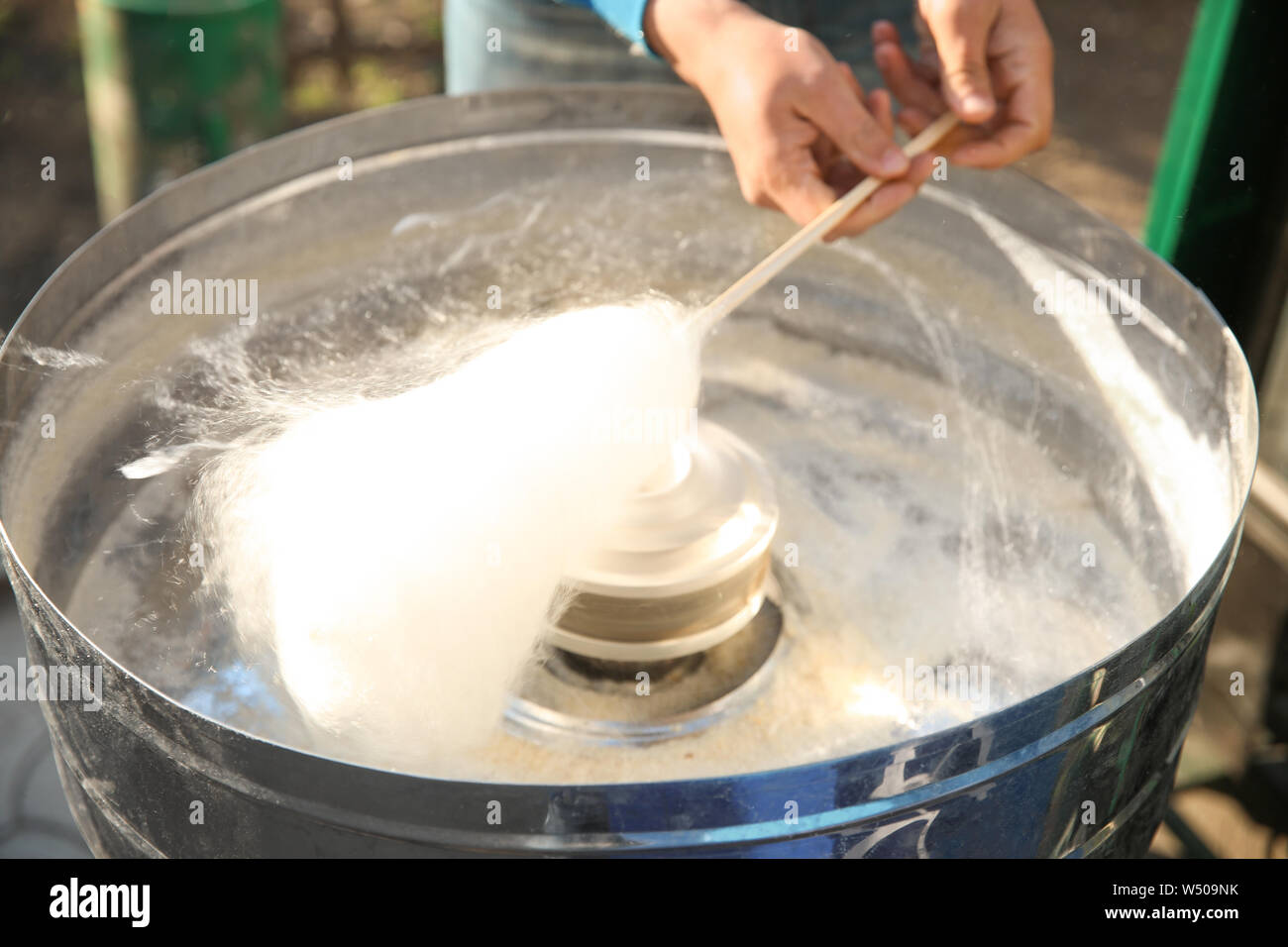 Making of sweet cotton candy outdoors Stock Photo - Alamy