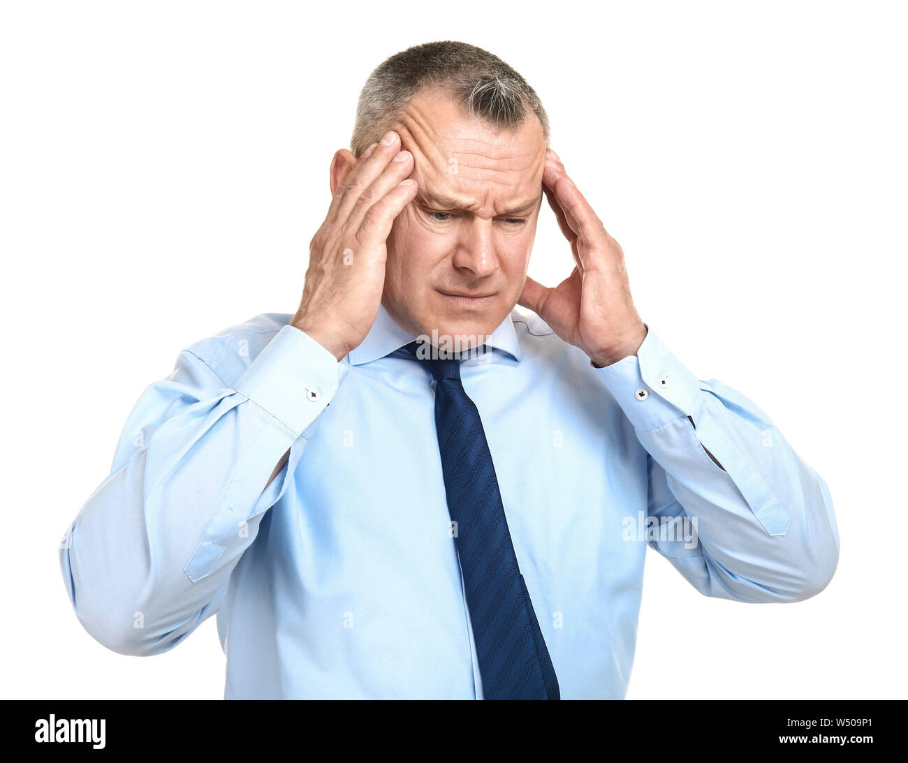 Handsome middle-aged man suffering from head ache on white background ...