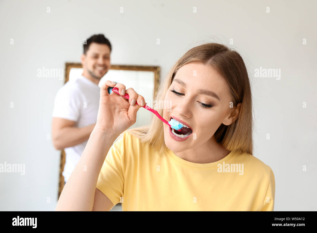 Beautiful woman cleaning teeth hi-res stock photography and images - Alamy