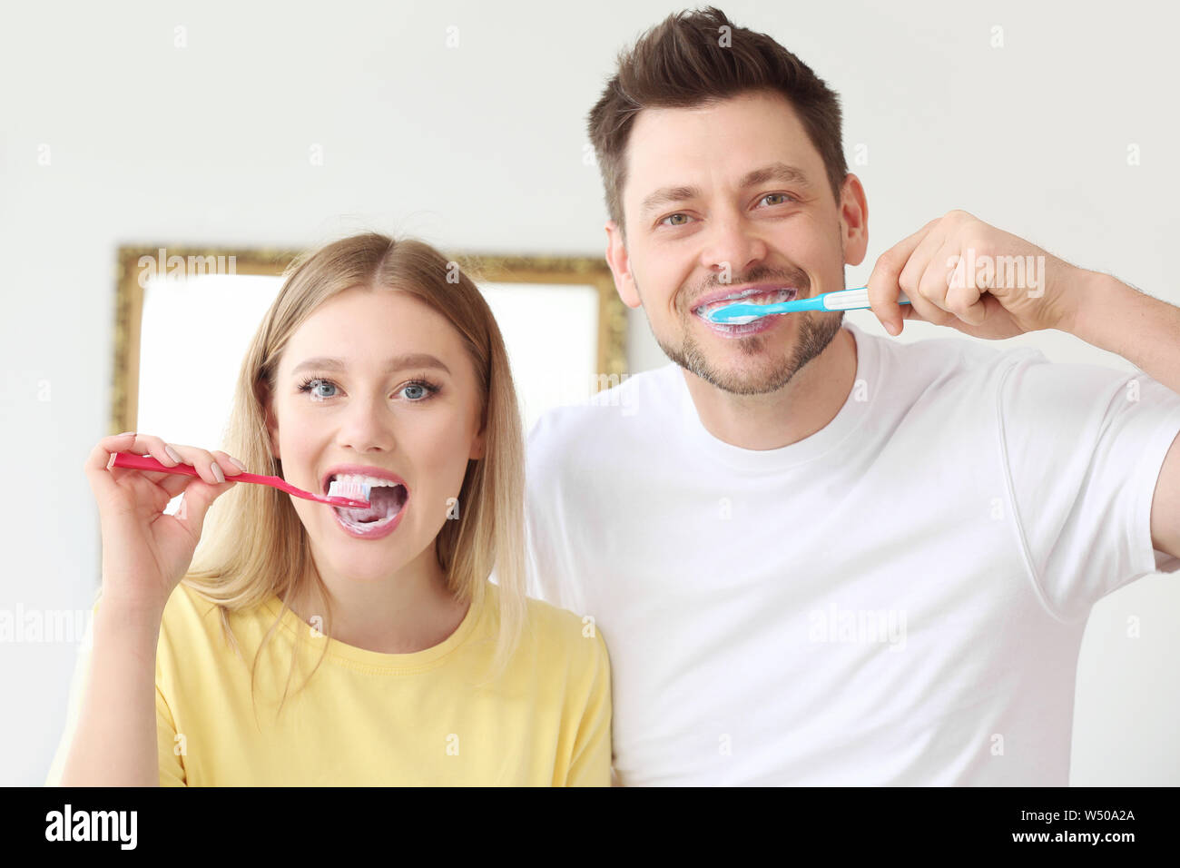 Brush teeth couple hi-res stock photography and images - Alamy