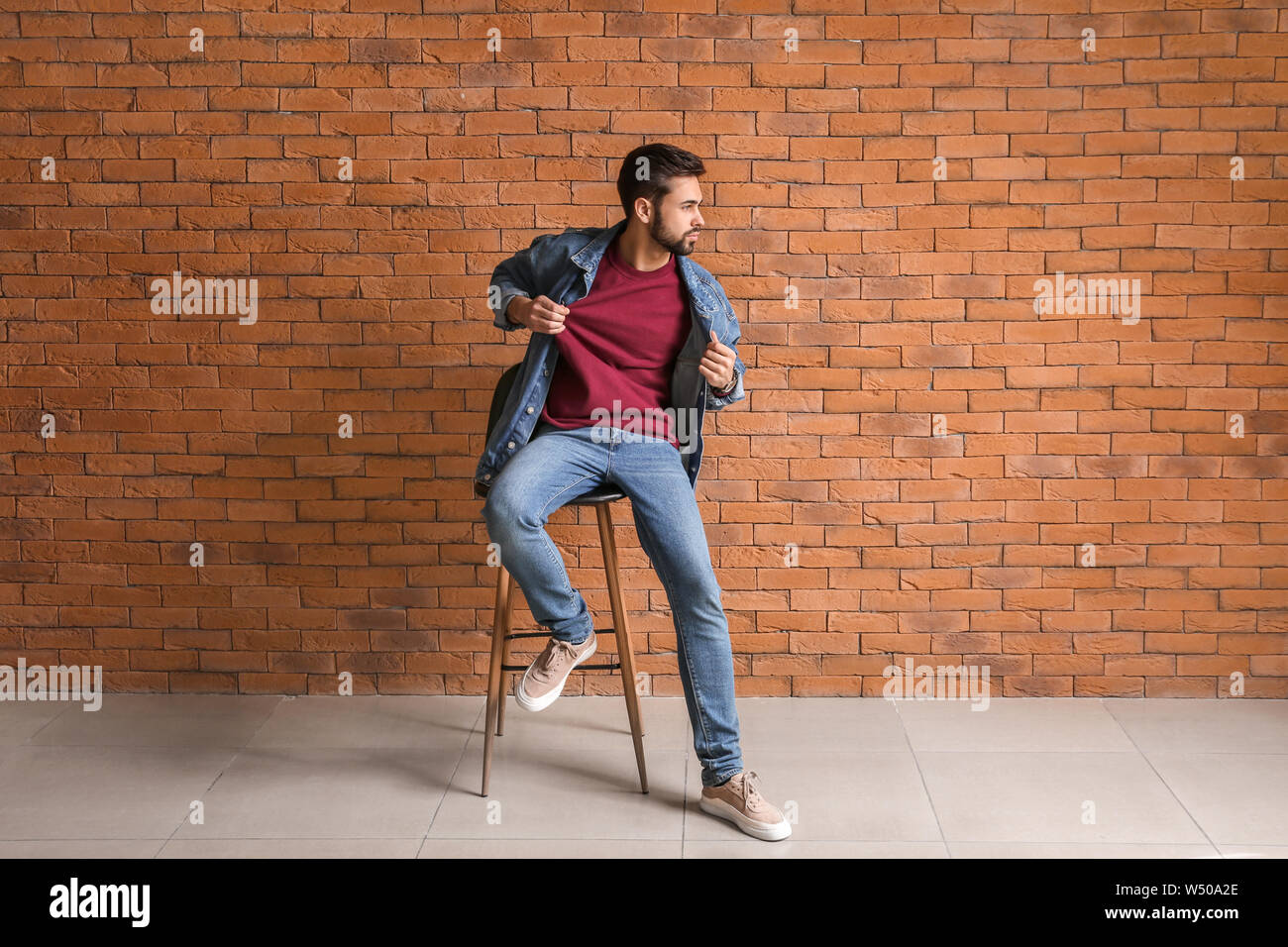 Man sitting near high wall hi-res stock photography and images - Alamy