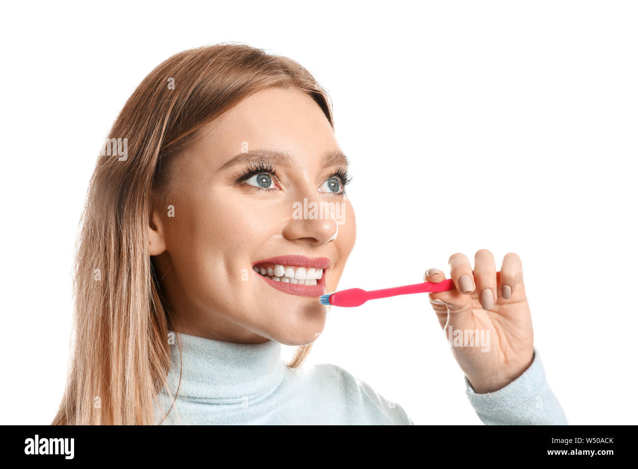 Woman cleaning teeth on white background Stock Photo - Alamy