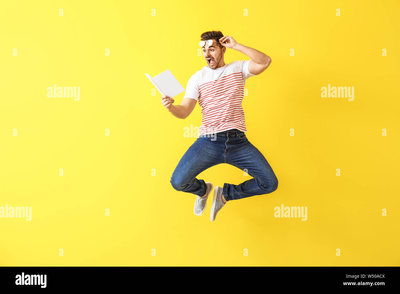 Man reading book shocked expression hi-res stock photography and images ...