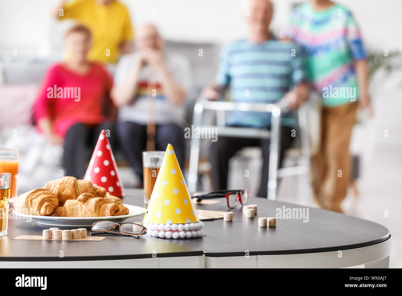 Table with party decor and bingo game on table in nursing home Stock ...