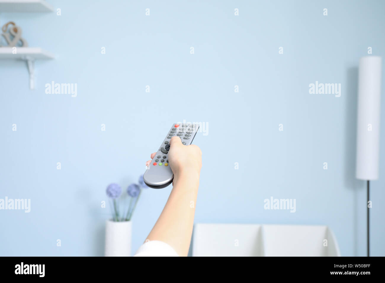 Woman tv remote hi-res stock photography and images - Alamy