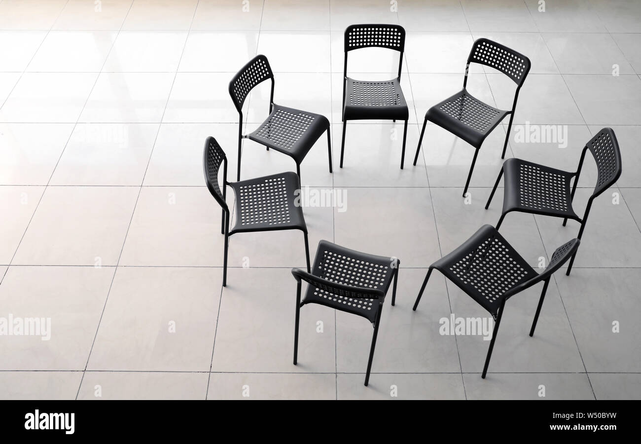 Empty chairs prepared for group therapy indoors Stock Photo - Alamy