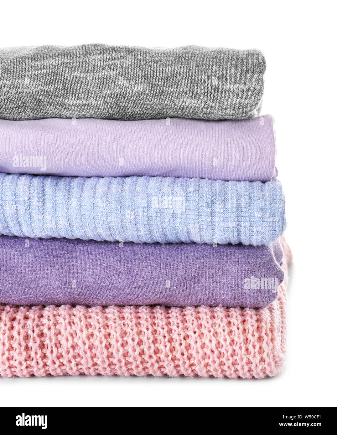 Stack of clean clothes on white background Stock Photo - Alamy