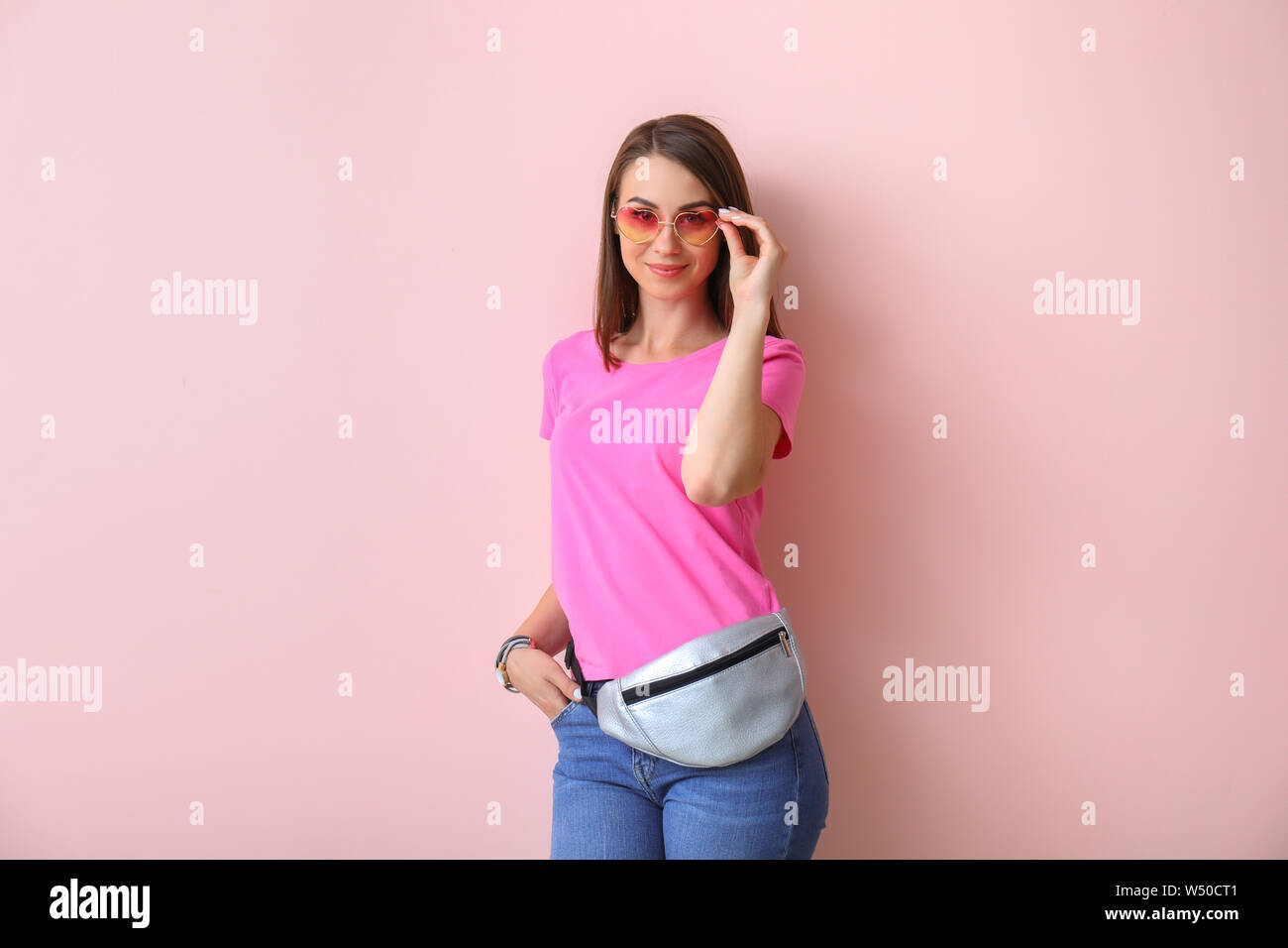 Beautiful young woman on color background Stock Photo - Alamy