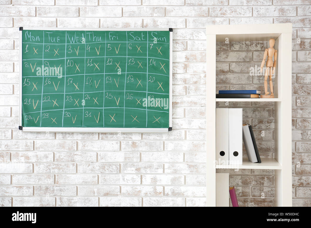 Blackboard with drawn calendar in office Stock Photo - Alamy