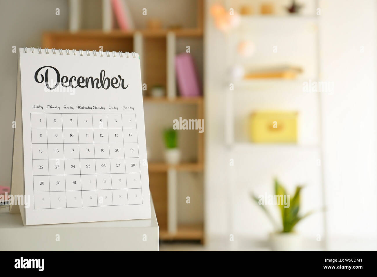 Calendar on table in room Stock Photo - Alamy